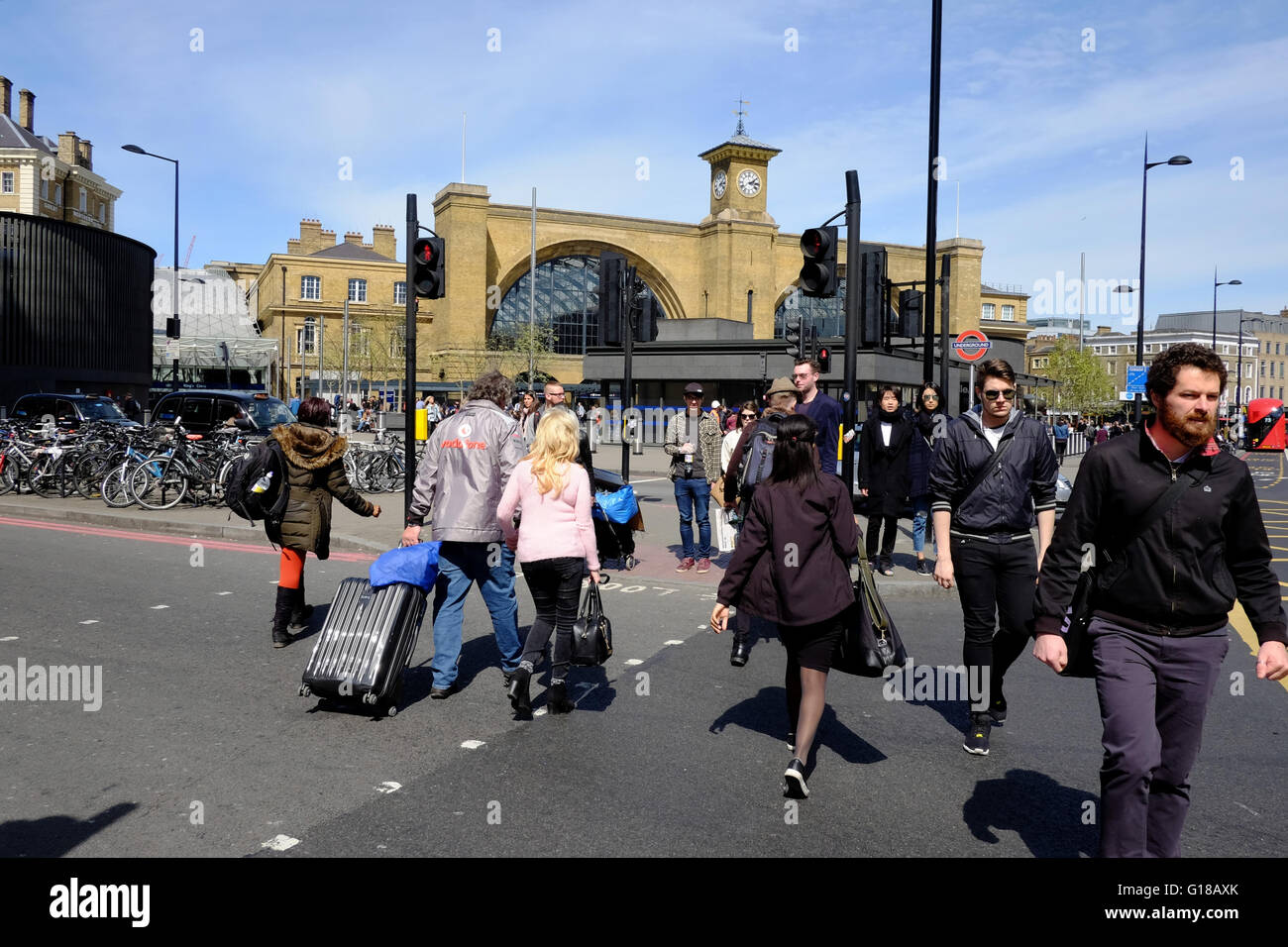 Commuters crossing road outside Kings Cross Railway Station, London ...