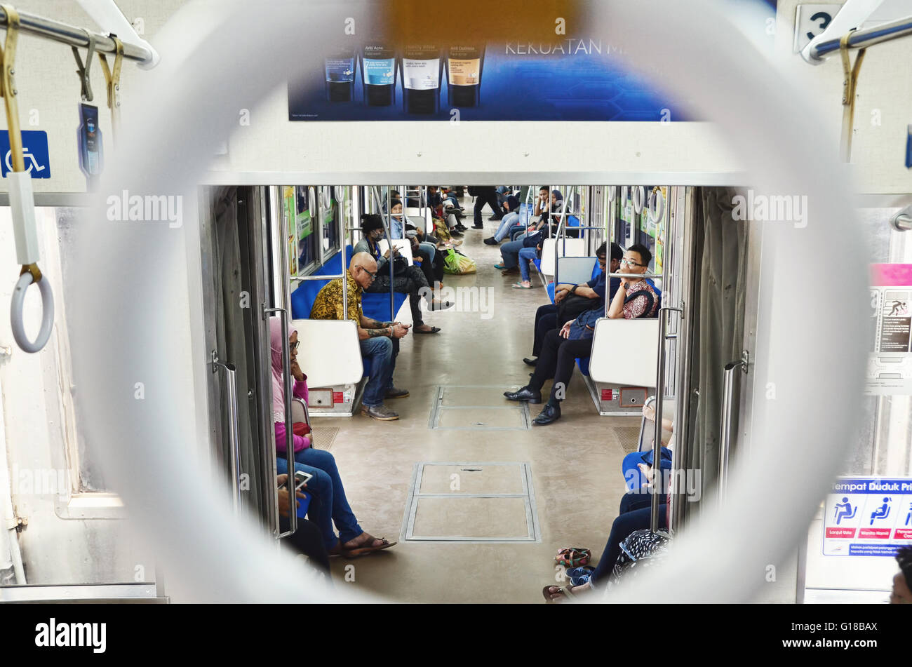 A train scene look through a hole of a hanging handrail Stock Photo - Alamy