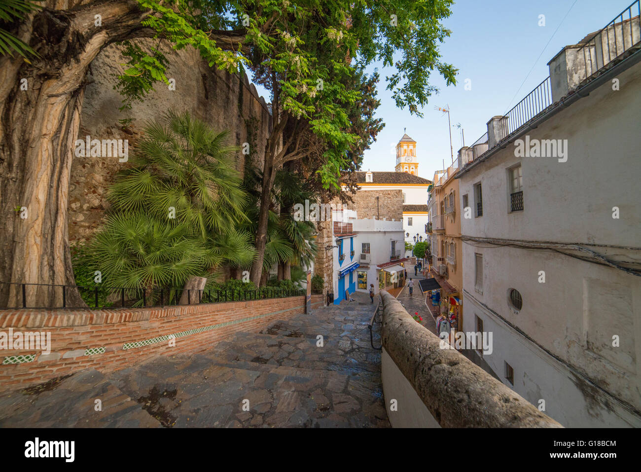 Spanish traditional street with church in background, Marbella Stock ...