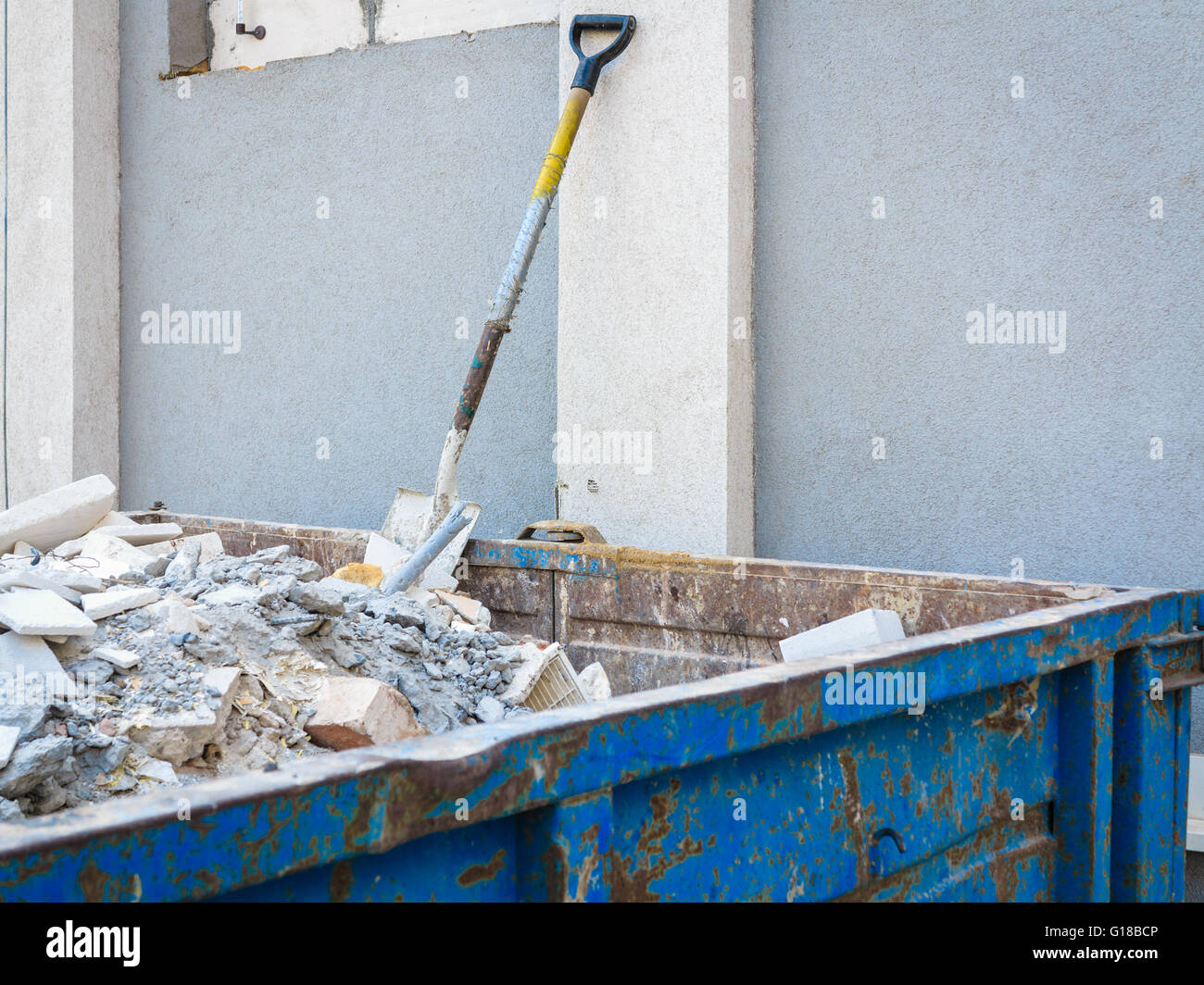 Trash construction building demolition waste hard work concept. Spade ...