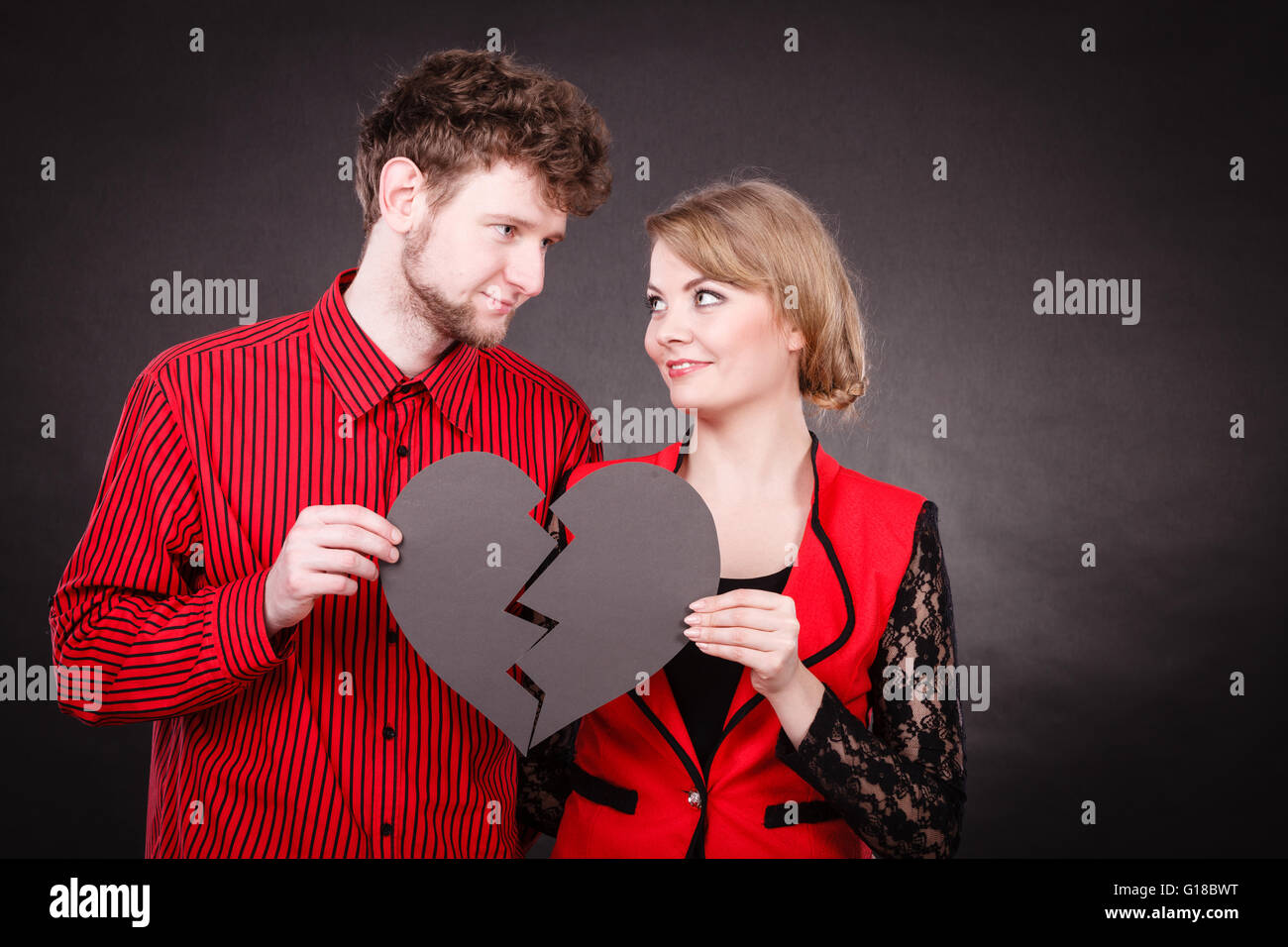 Heal love concept. Couple woman and man holding two halves of broken ...