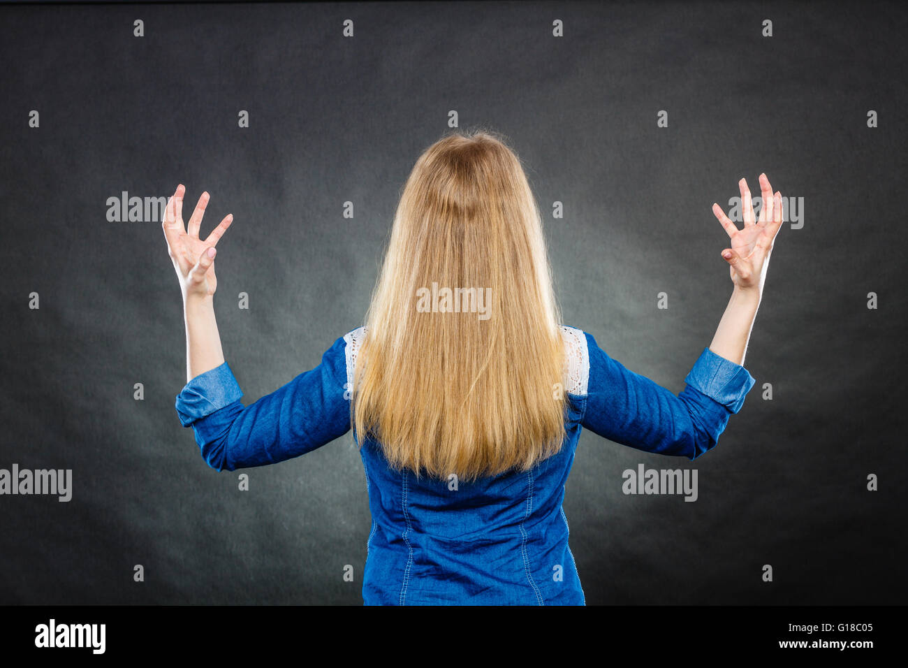 Fury and big anger inside of people. Blonde furious woman making hands ...