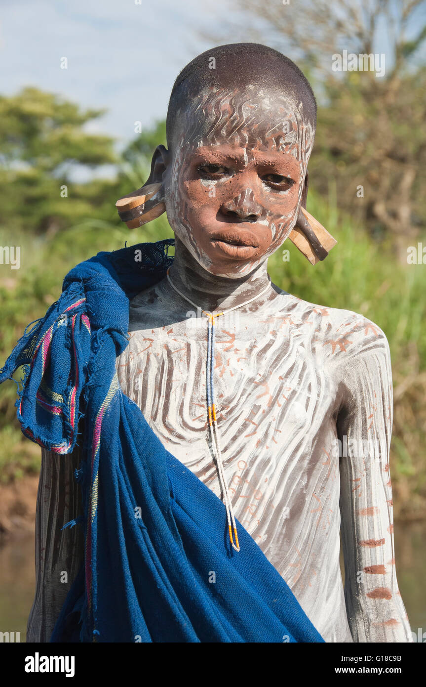 Surma girl with body paintings and ear plates, Kibish, Omo River Valley ...