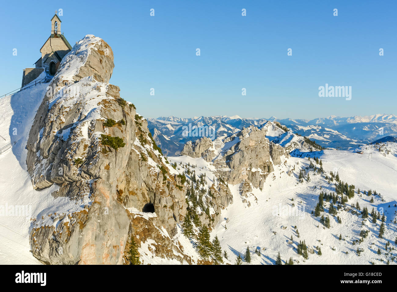 Alpine chapel perched on the peak of a snowy mountain Stock Photo - Alamy