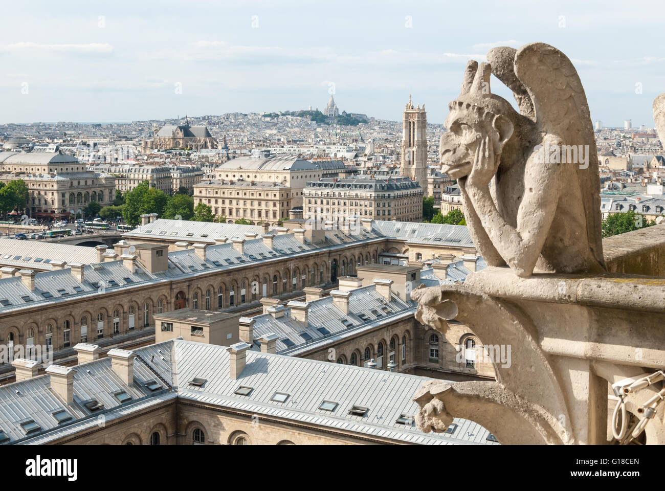 A spitting gargoyle sits on top of Notre Dame surveying the Parisian ...