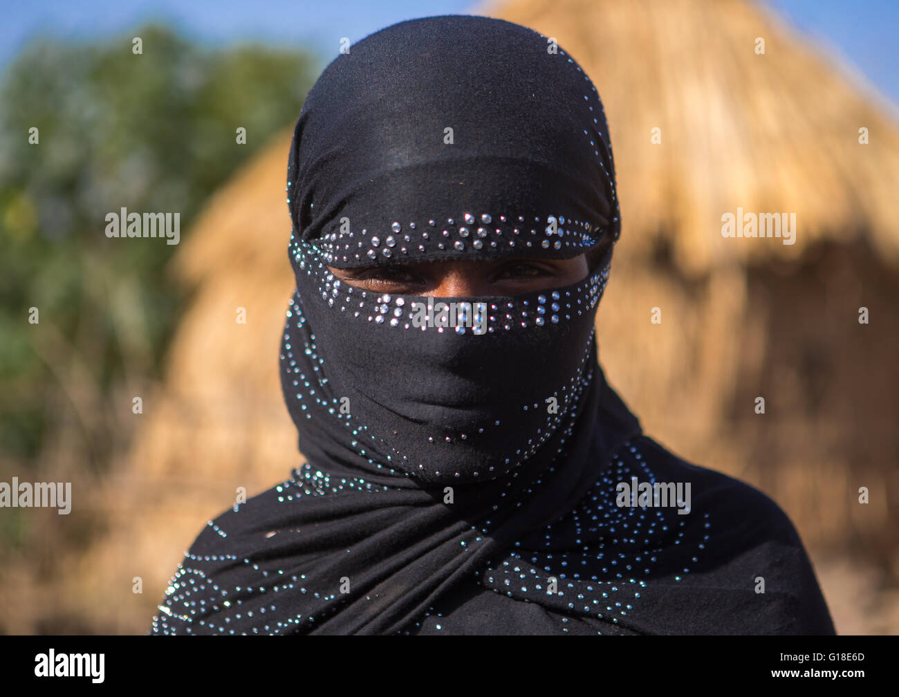 Portrait of an oromo woman with face covered, Amhara region, Artuma ...