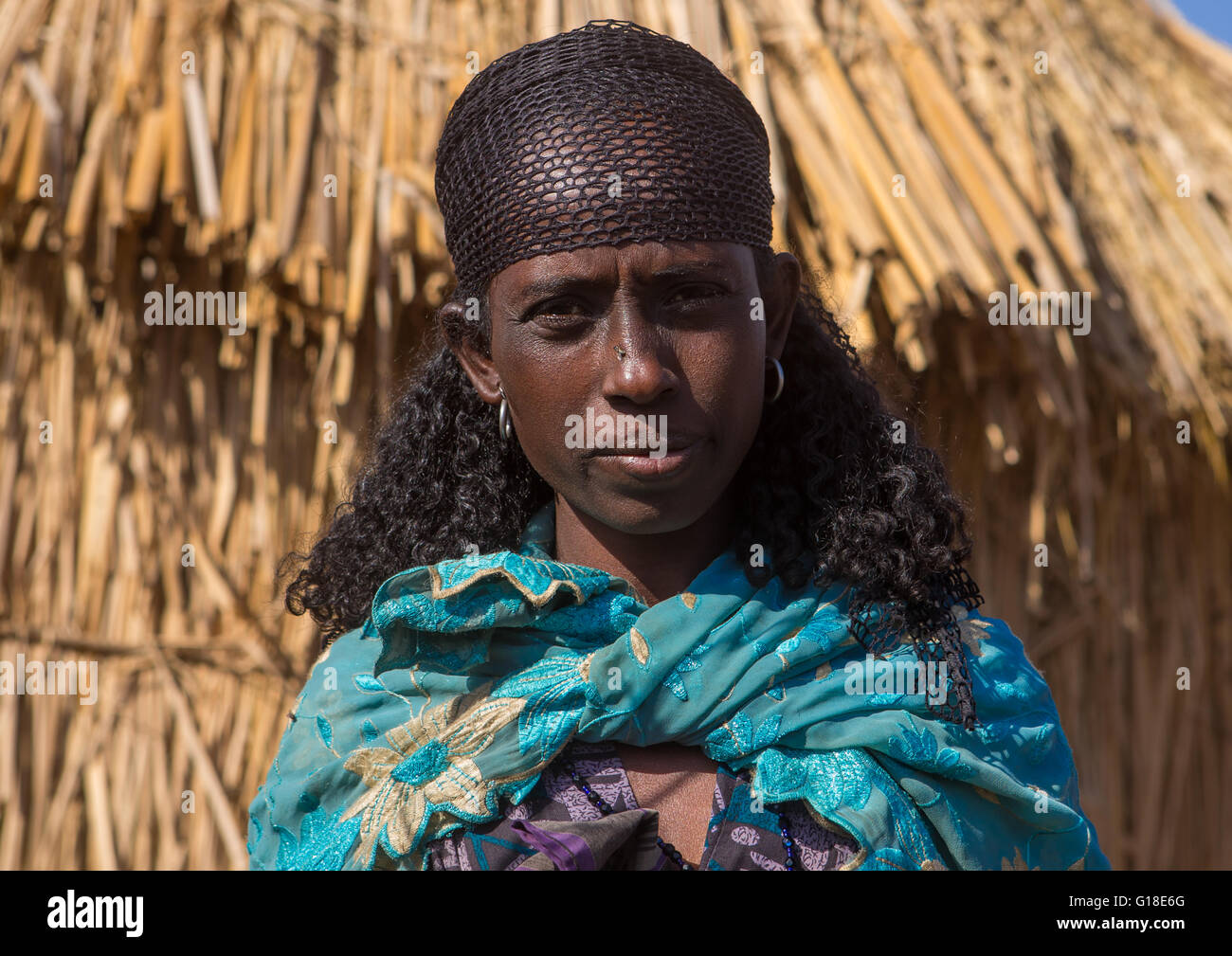 Portrait of an oromo woman with curly hair, Amhara region, Artuma ...