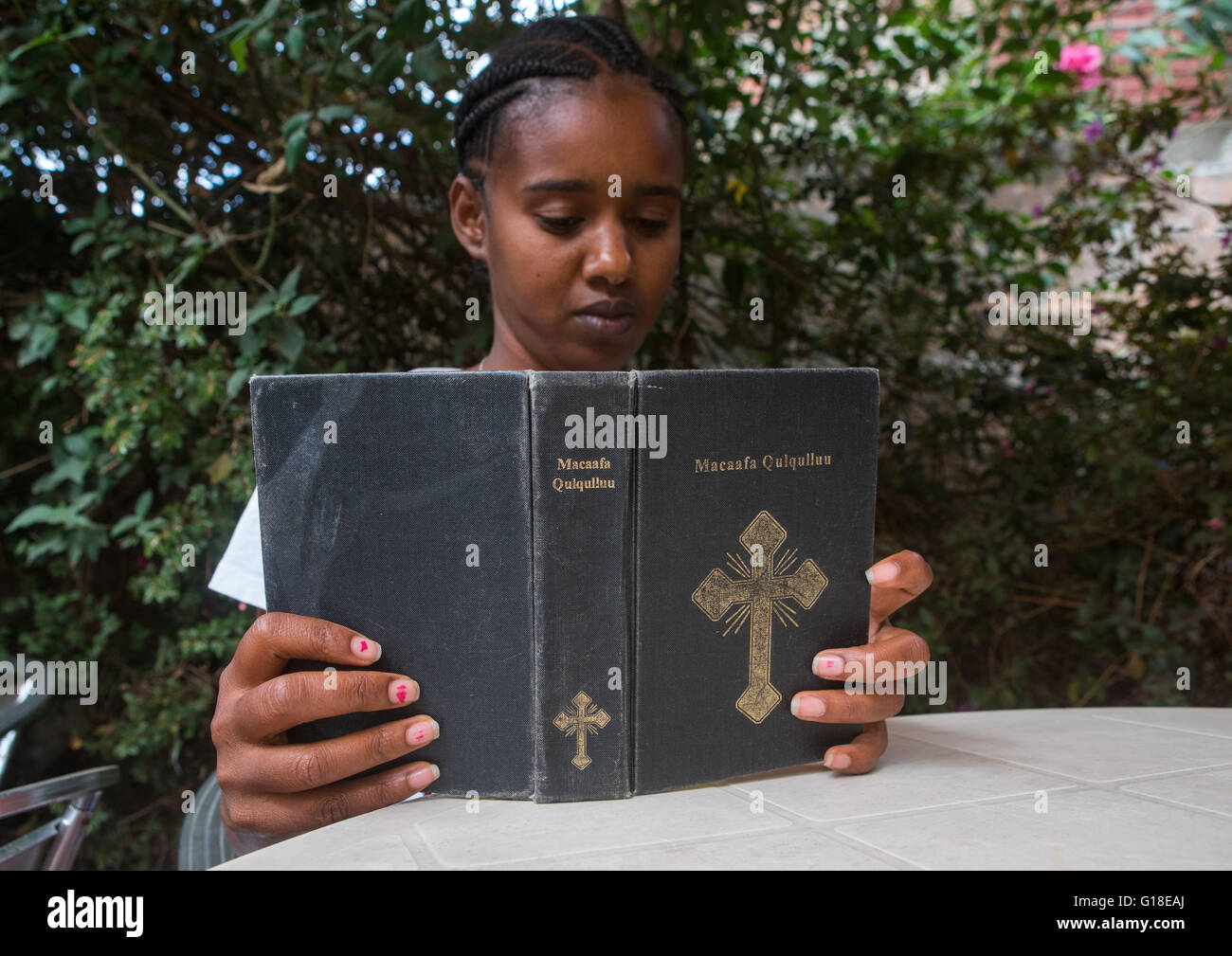 A karrayyu tribe girl called aliya reading bible in oromo language ...