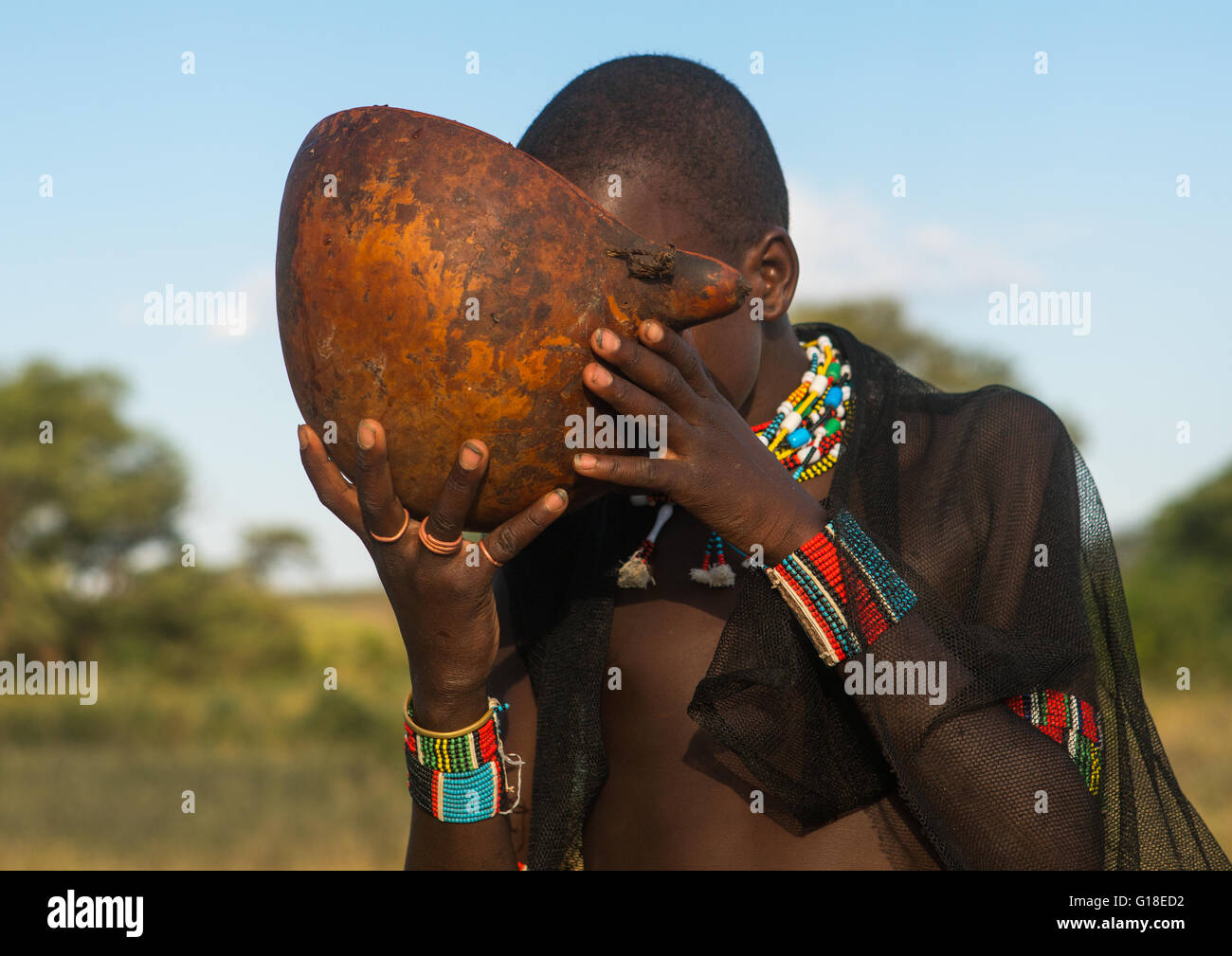 Hamer tribe whipper drinking alcohol before the bull jumping ceremony ...