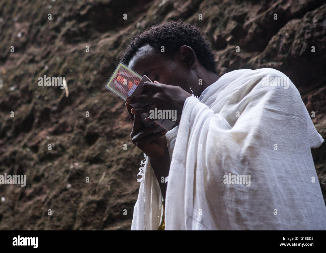 Ethiopian orthodox man kissing his bible, Amhara region, Lalibela ...