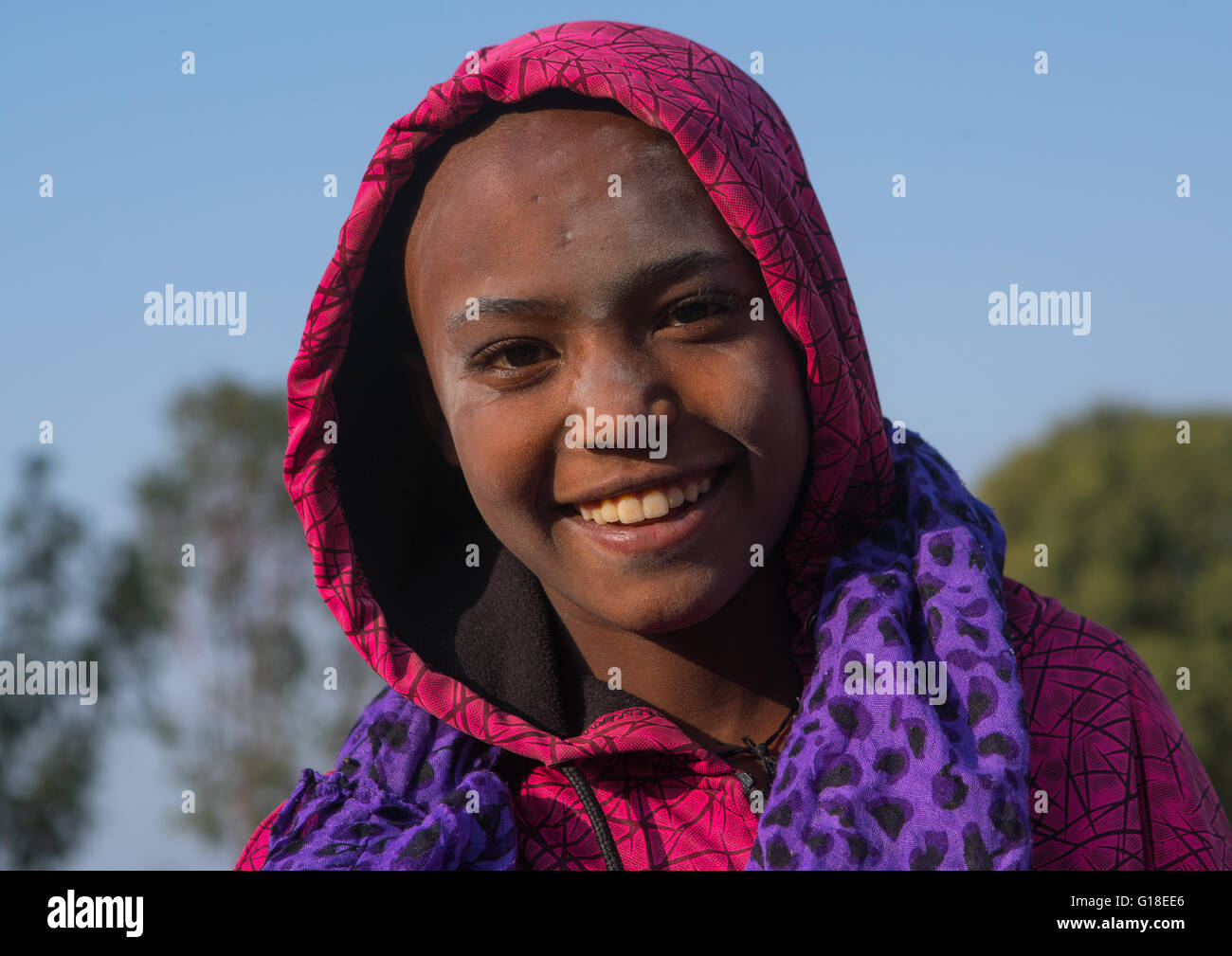 Pilgrim woman with a cross sign on the forehead during kidane mehret ...