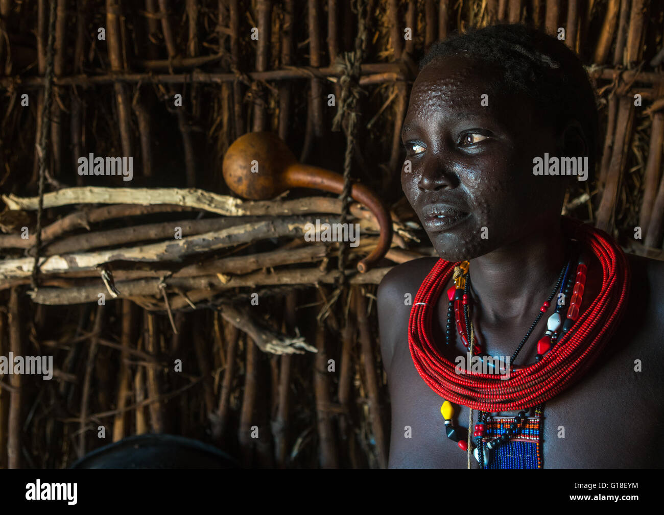 Toposa tribe woman with scarified face and red necklaces, Omo valley ...