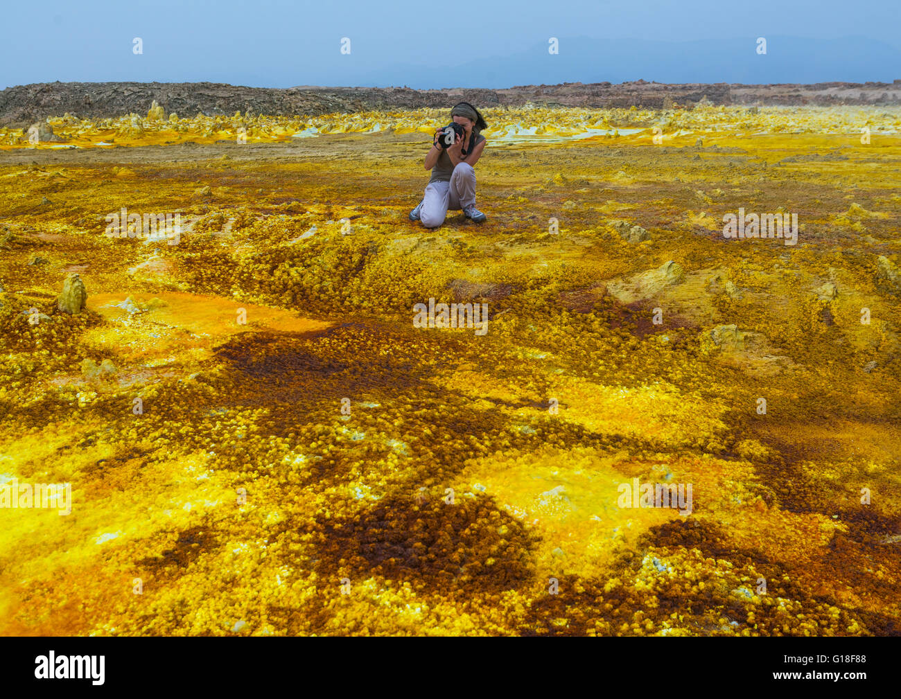 Tourist taking picture of the colorful volcanic landscape of dallol in ...
