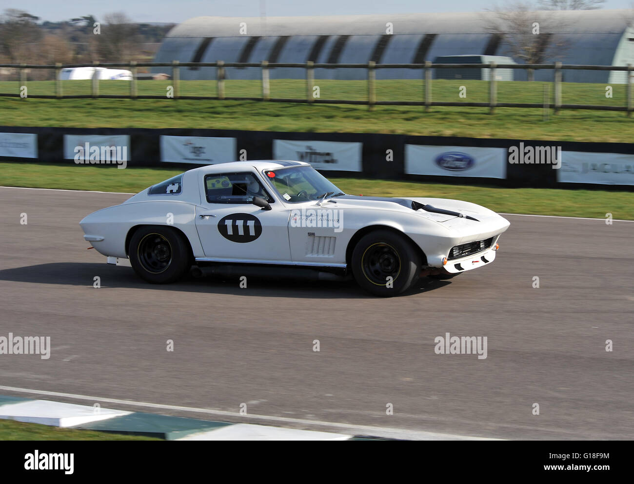 Classic 1960s race car going through the chicane at Goodwood motor ...