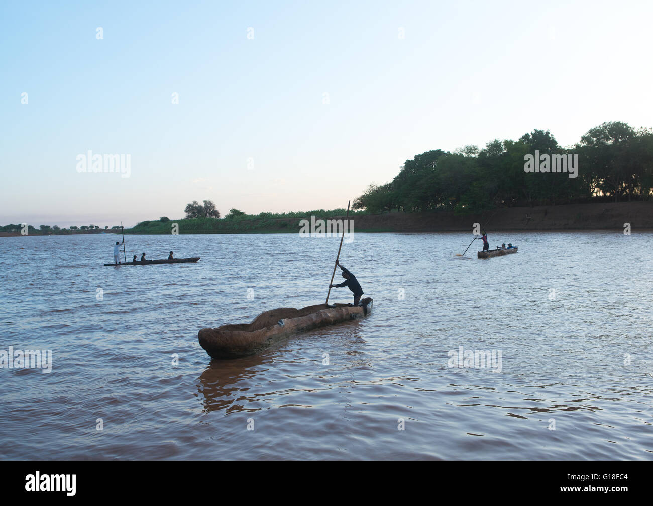 Trunk boats crossing the omo river, Omo valley, Omorate, Ethiopia Stock ...