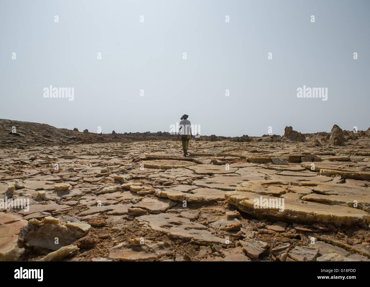 Afar man in the volcanic formations of the danakil depression, Afar ...