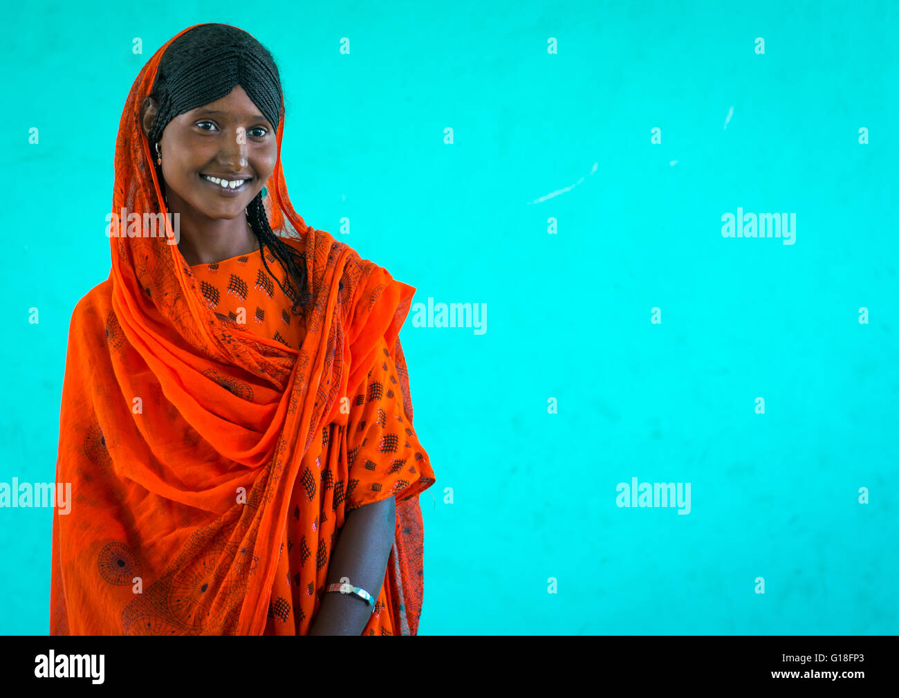 Portrait Of An Afar Tribe Girl With Braided Hair And Sharpened Teeth