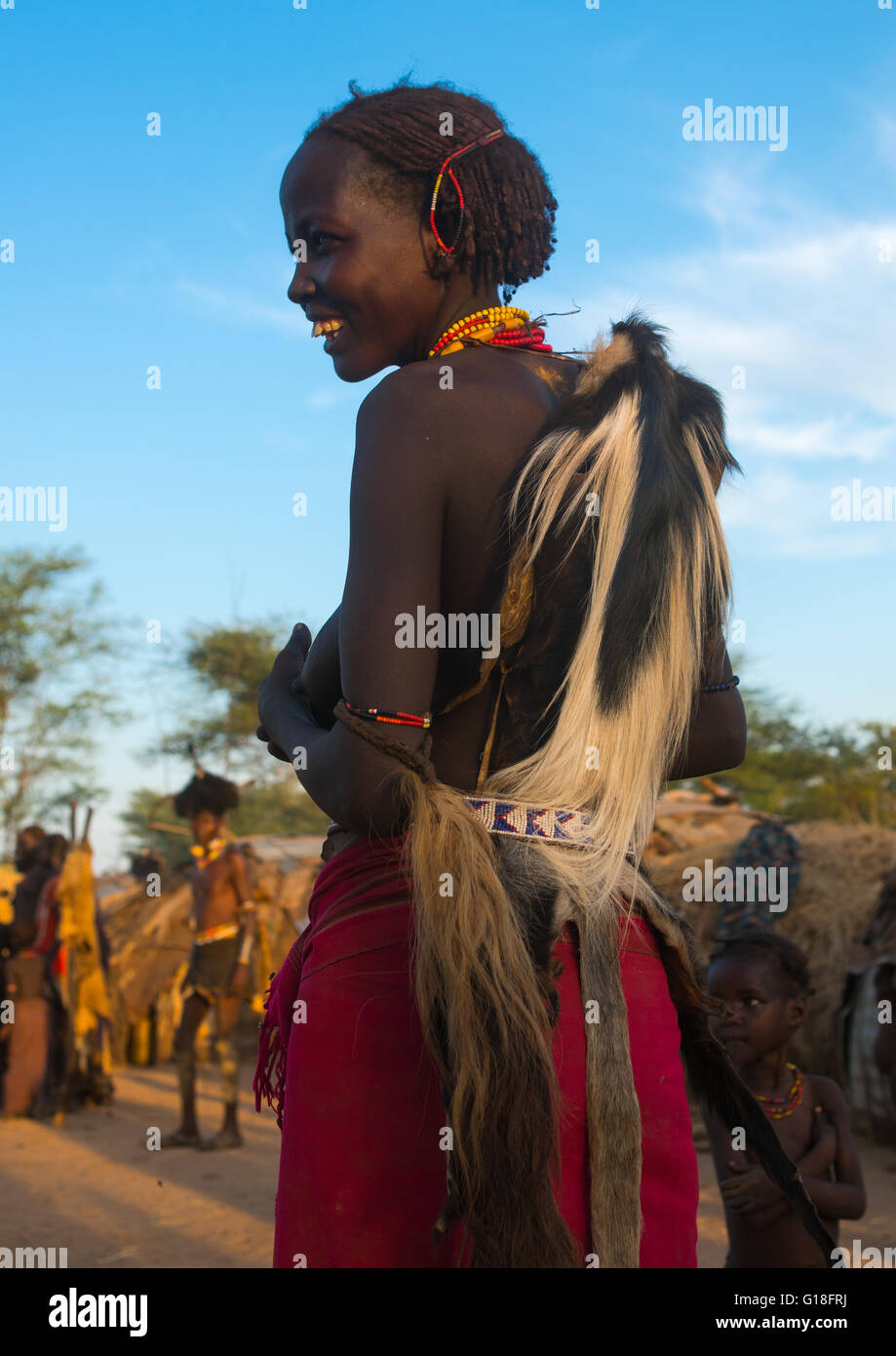 Dassanech tribe woman with colobus monkey skin during dimi ceremony to ...