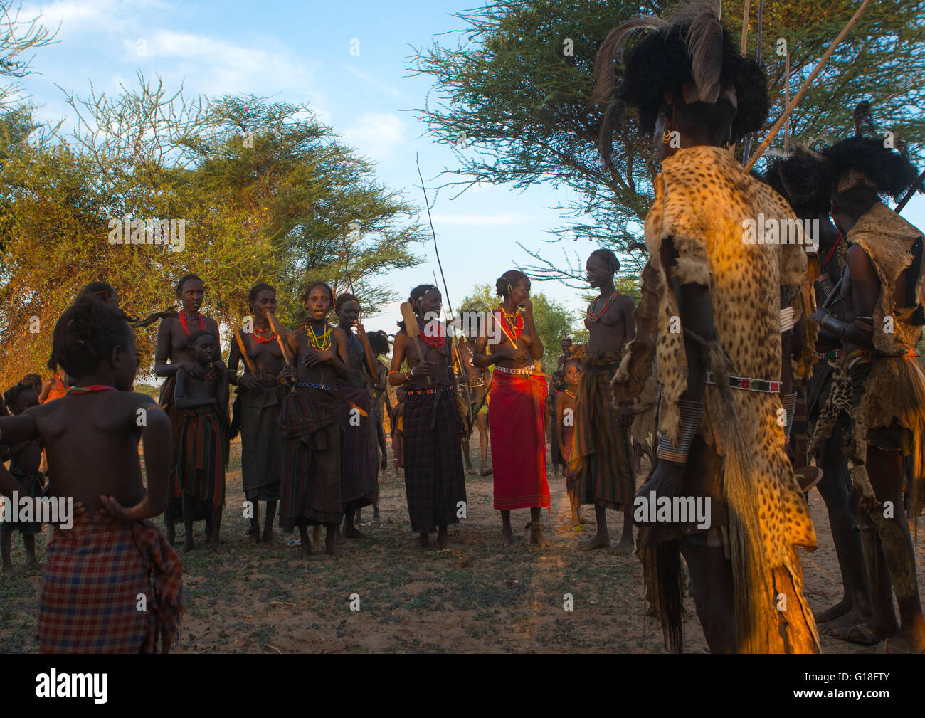 Dassanech men and women during dimi ceremony to celebrate circumcision ...