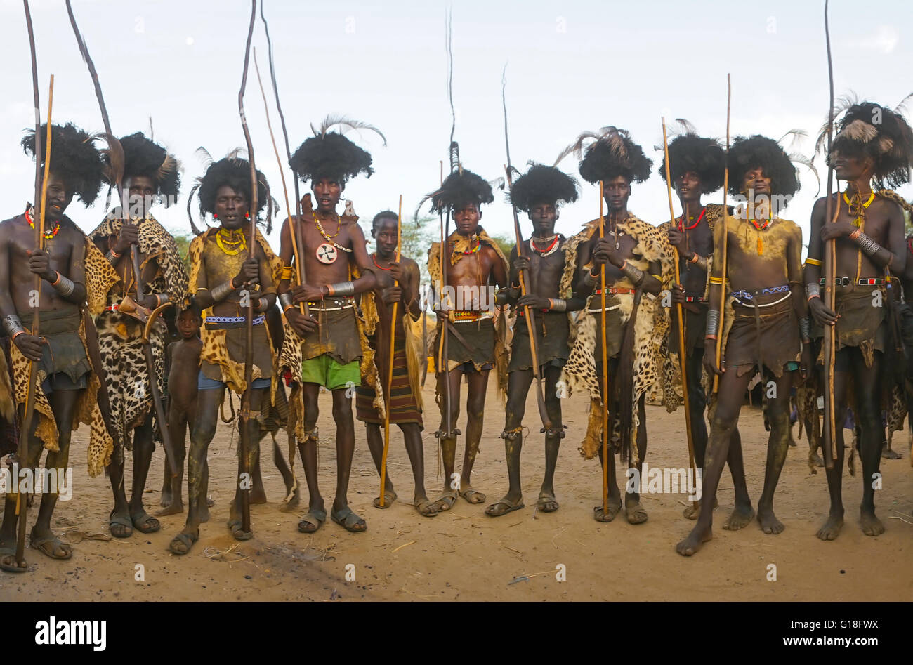 Dassanech men with leopard skins and ostrich feathers headwears during ...
