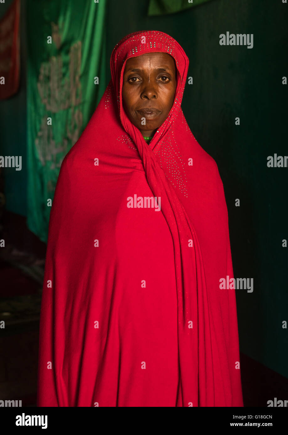 Sufi woman worshipper in red veil, Harari region, Harar, Ethiopia Stock ...