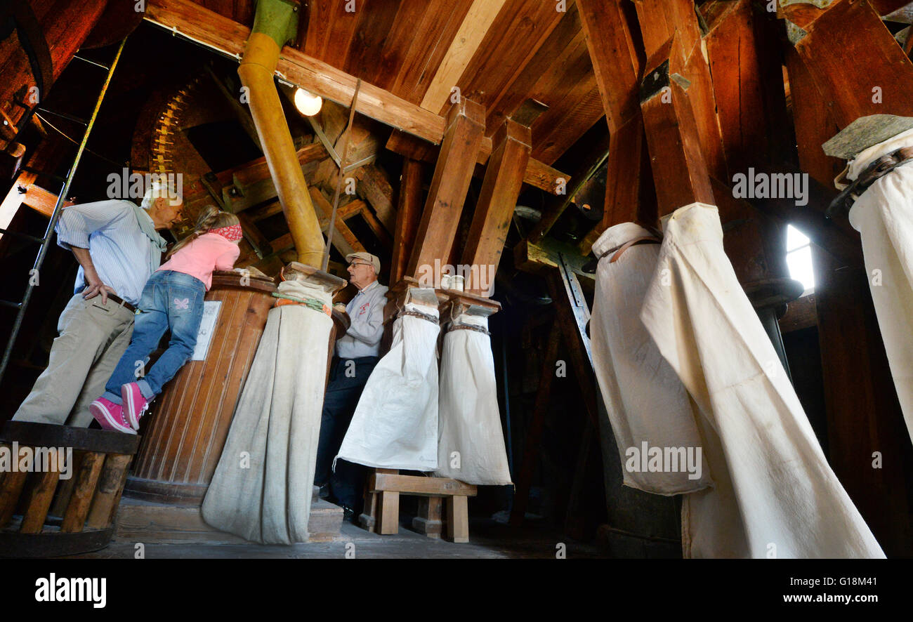 80-year-old mill foreman Reinhard Ebbecke (r) explains two visitors how ...