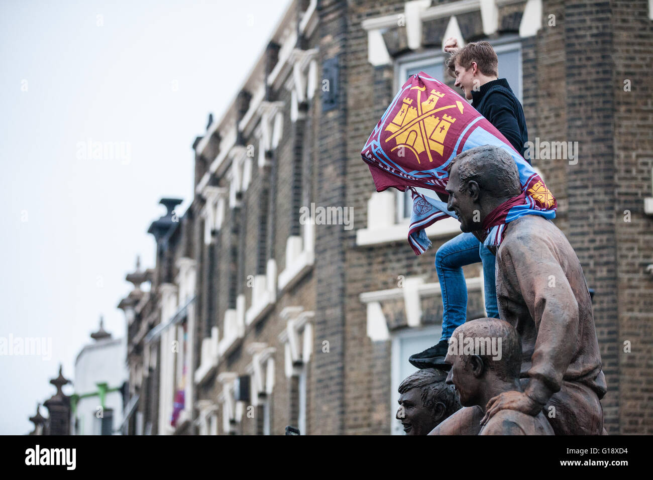 London, UK. 10th May, 2016. A West Ham climbs on The Champions bronze ...
