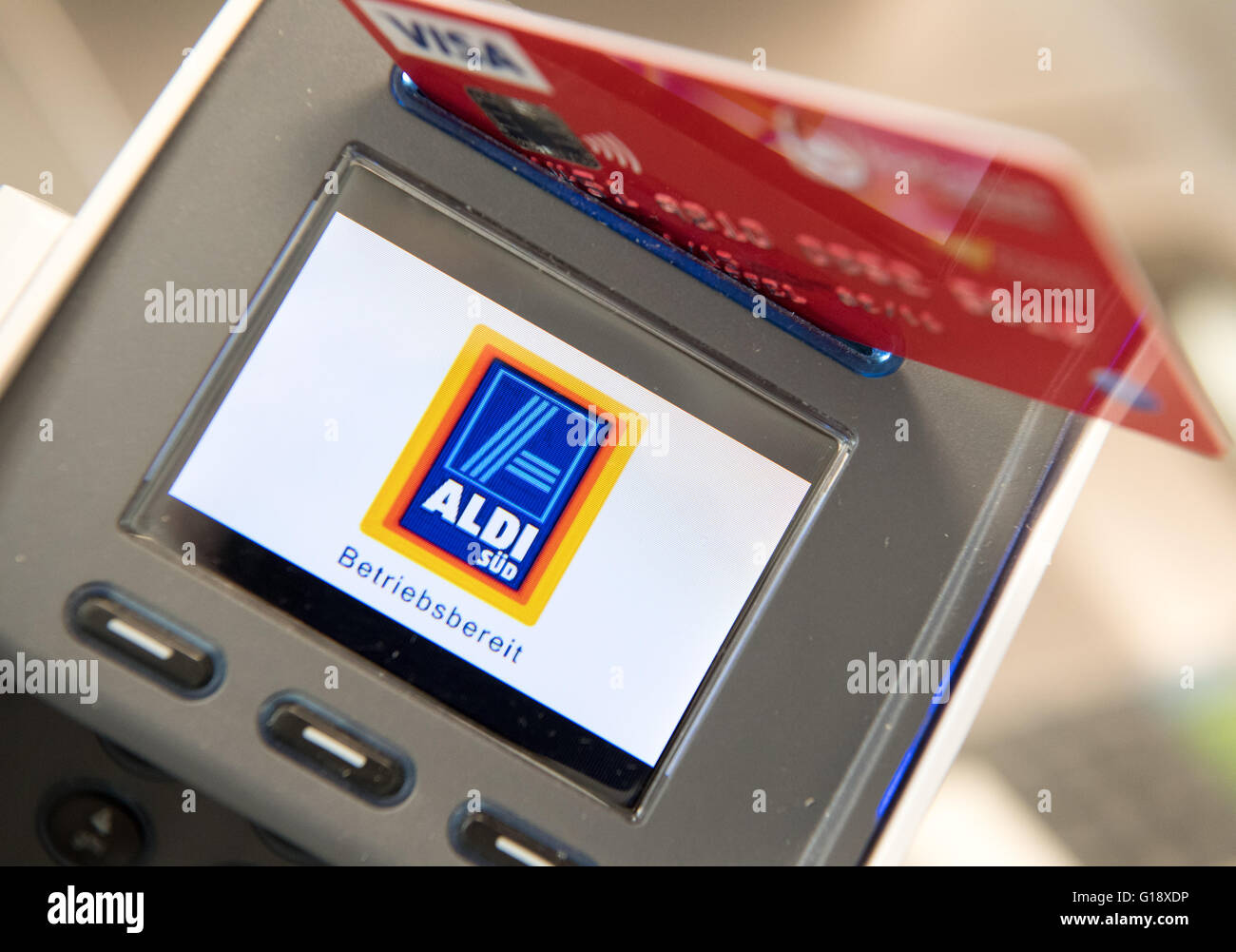 A credit card is inserted into the card machine at the redesigned Aldi ...