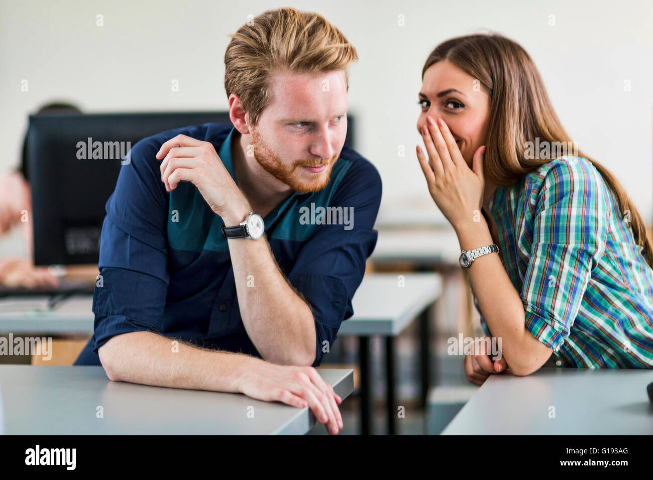 Students cheating by whispering to each other in a classroom Stock ...