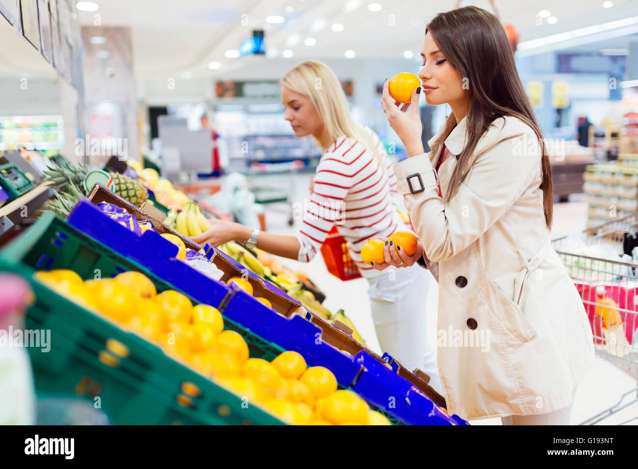 Beautiful women shopping vegetables and fruits in supermarket Stock ...