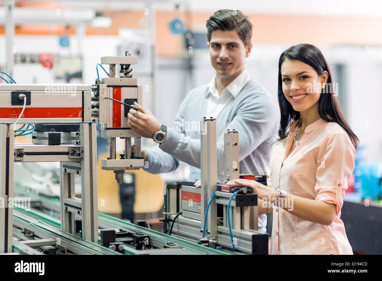 Two young students working on a science project together in lab Stock ...