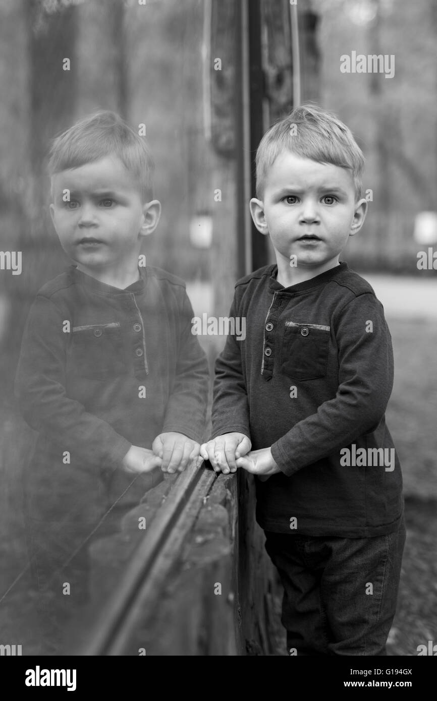 Handsome little boy seriously thinking Stock Photo - Alamy