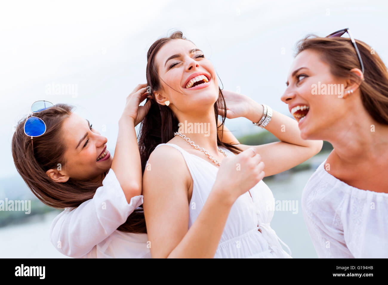 Cheerful women having fun outdoors and laughing happily Stock Photo - Alamy