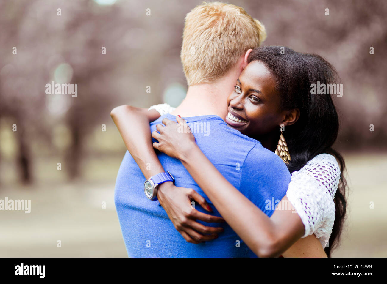 Couple in love hugging peacefully outdoors and being truly happy ...