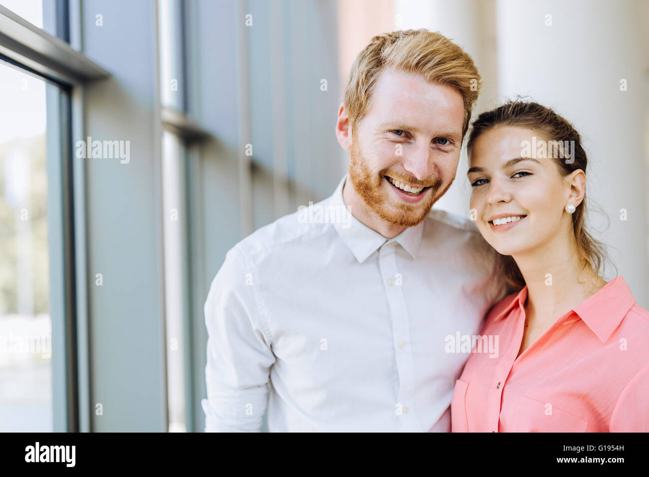 Beautiful colleagues in business smiling and being close to each other ...