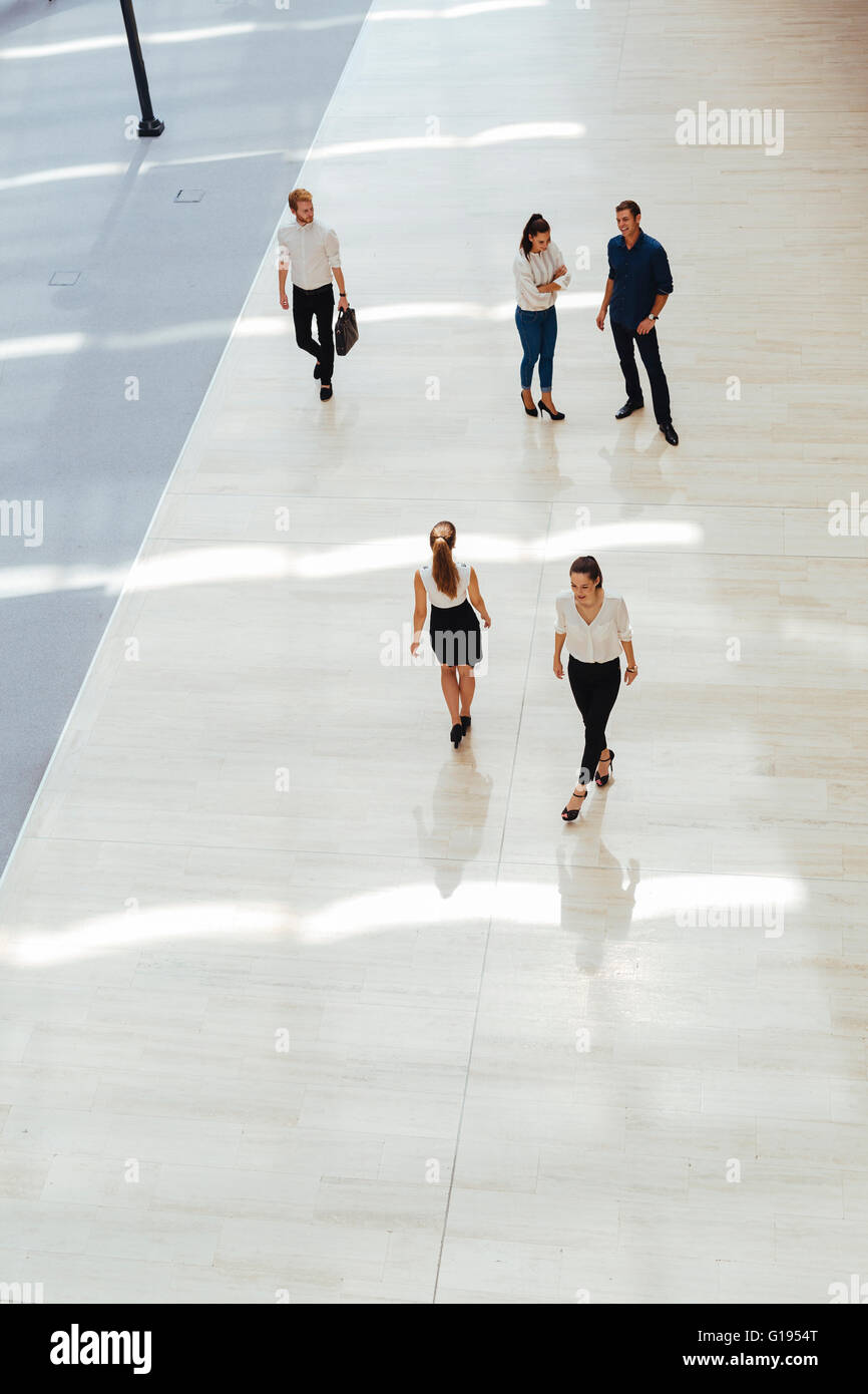 Young business people before starting work in their office Stock Photo ...