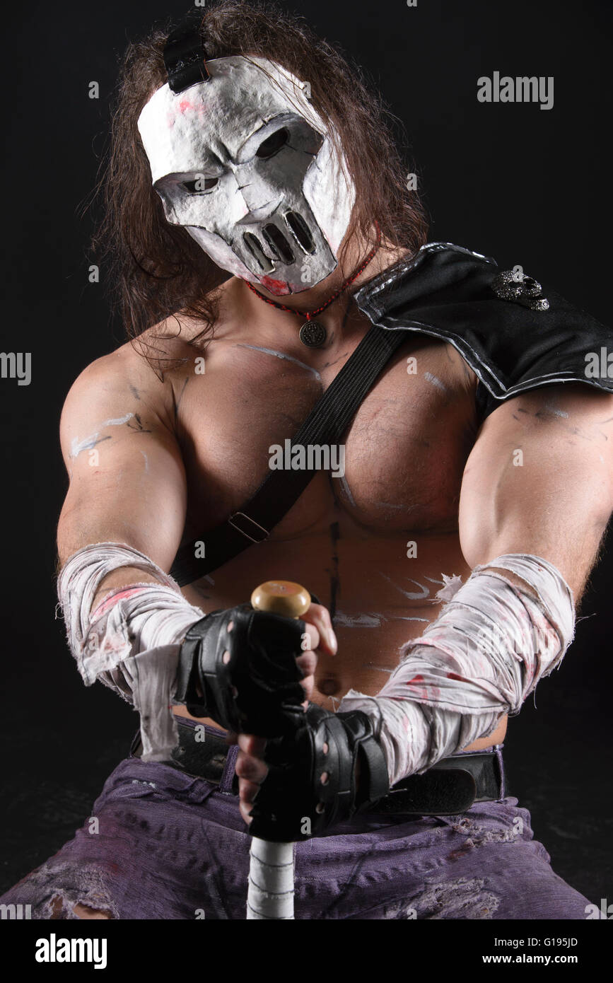 Costumed hero as a street maniac with a bat. Casey Jones on black ...