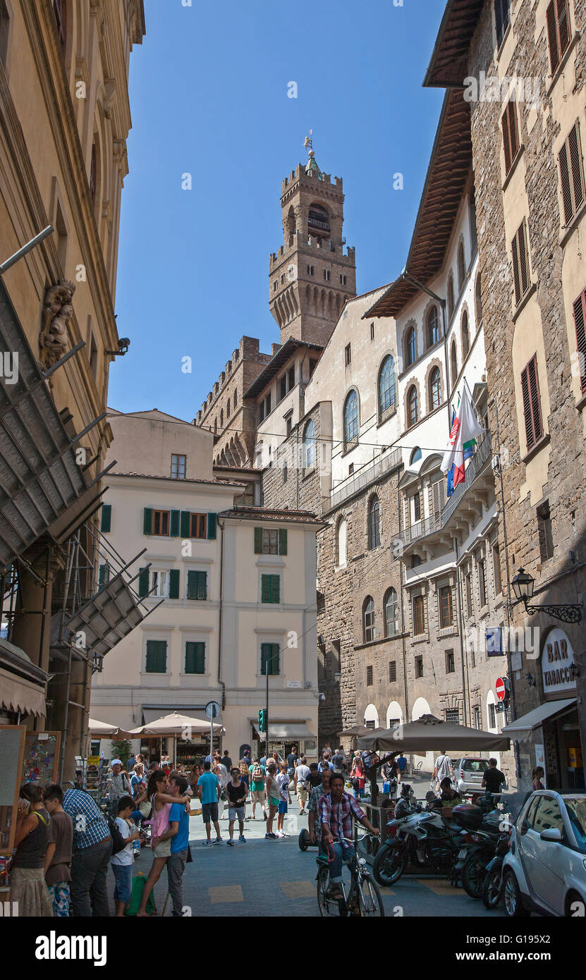 florence street scene with the Bell Tower of the Palazzo Vecchio, in ...