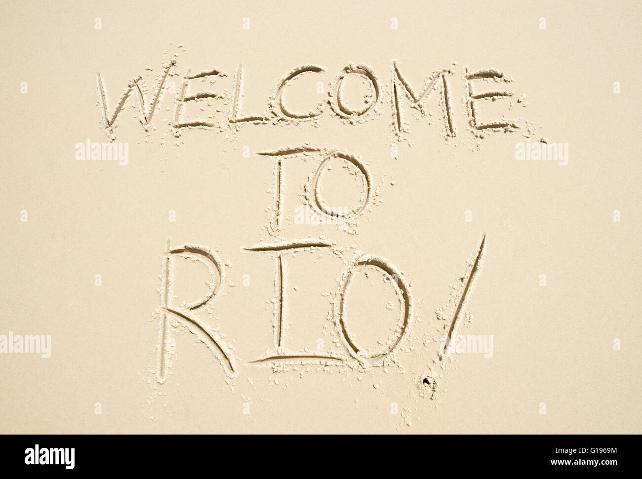 Welcome to Rio (as in, de Janeiro) message handwritten in smooth sand ...
