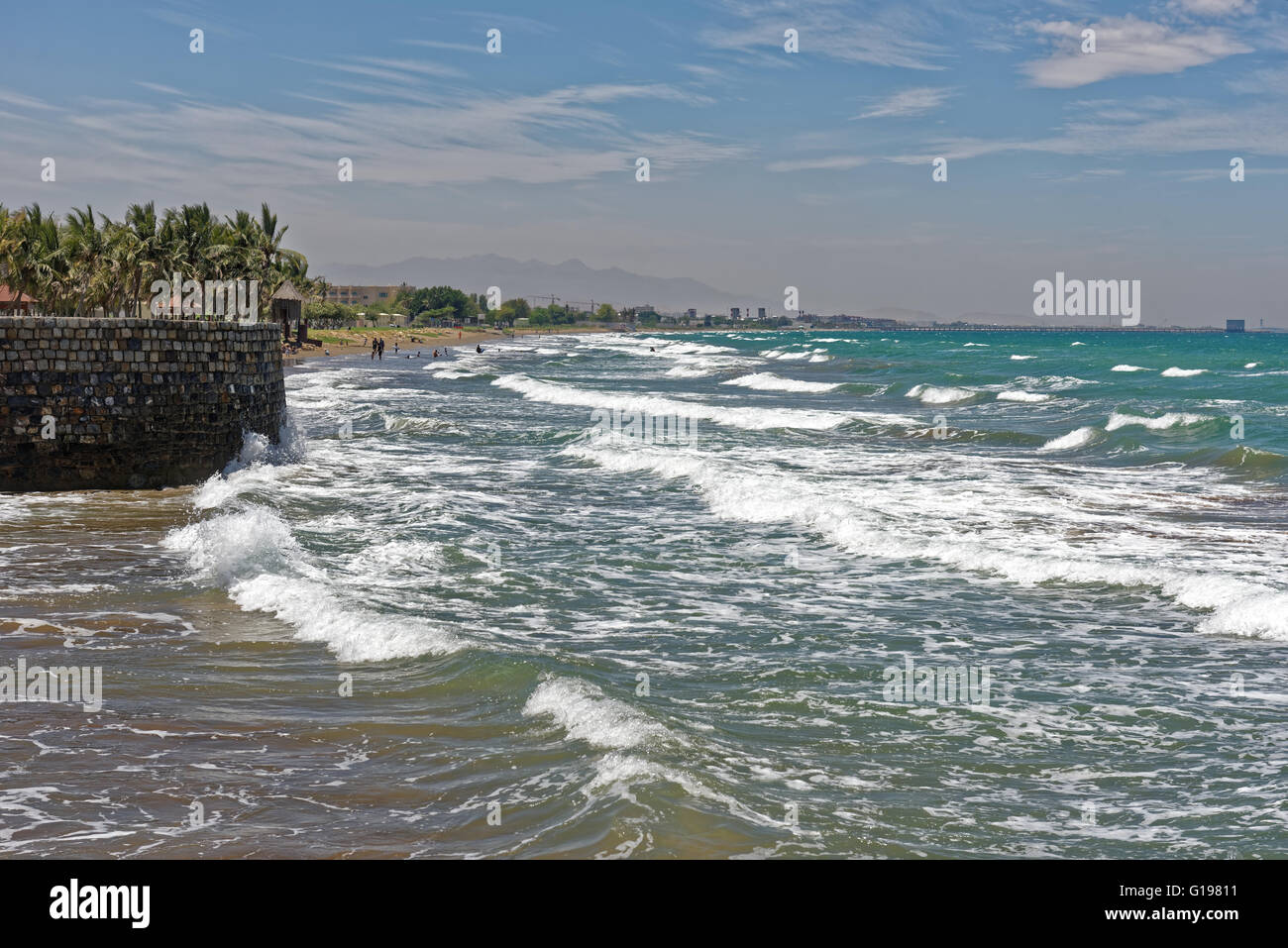 Waves running up to the beach on a windy day Stock Photo - Alamy