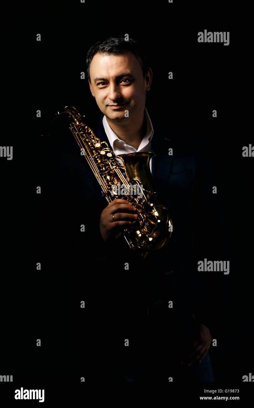 Portrait man playing saxophone hi-res stock photography and images - Alamy