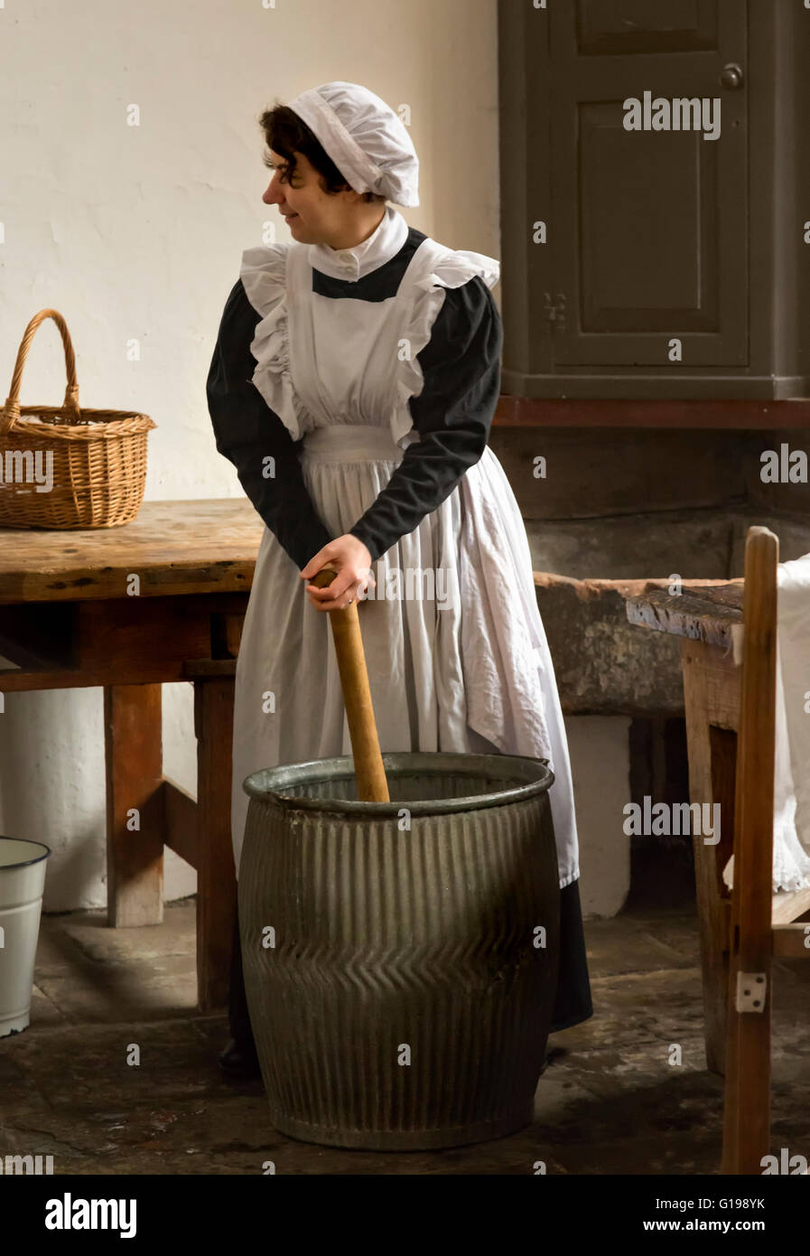 Demonstrating the old way of doing washing in Dunham Massey Stock Photo ...