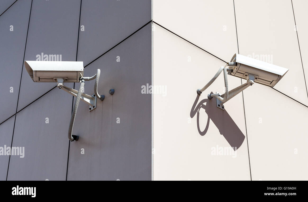 Surveillance cameras mounted on the corner of the building Stock Photo ...
