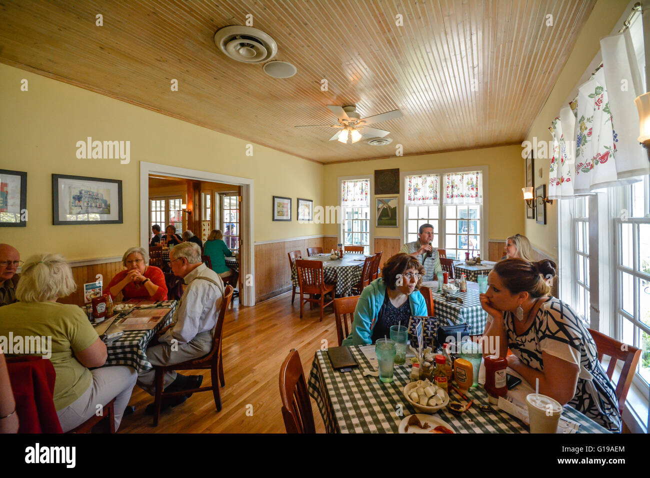 A crowd of people dining in old fashioned design styled room at the ...