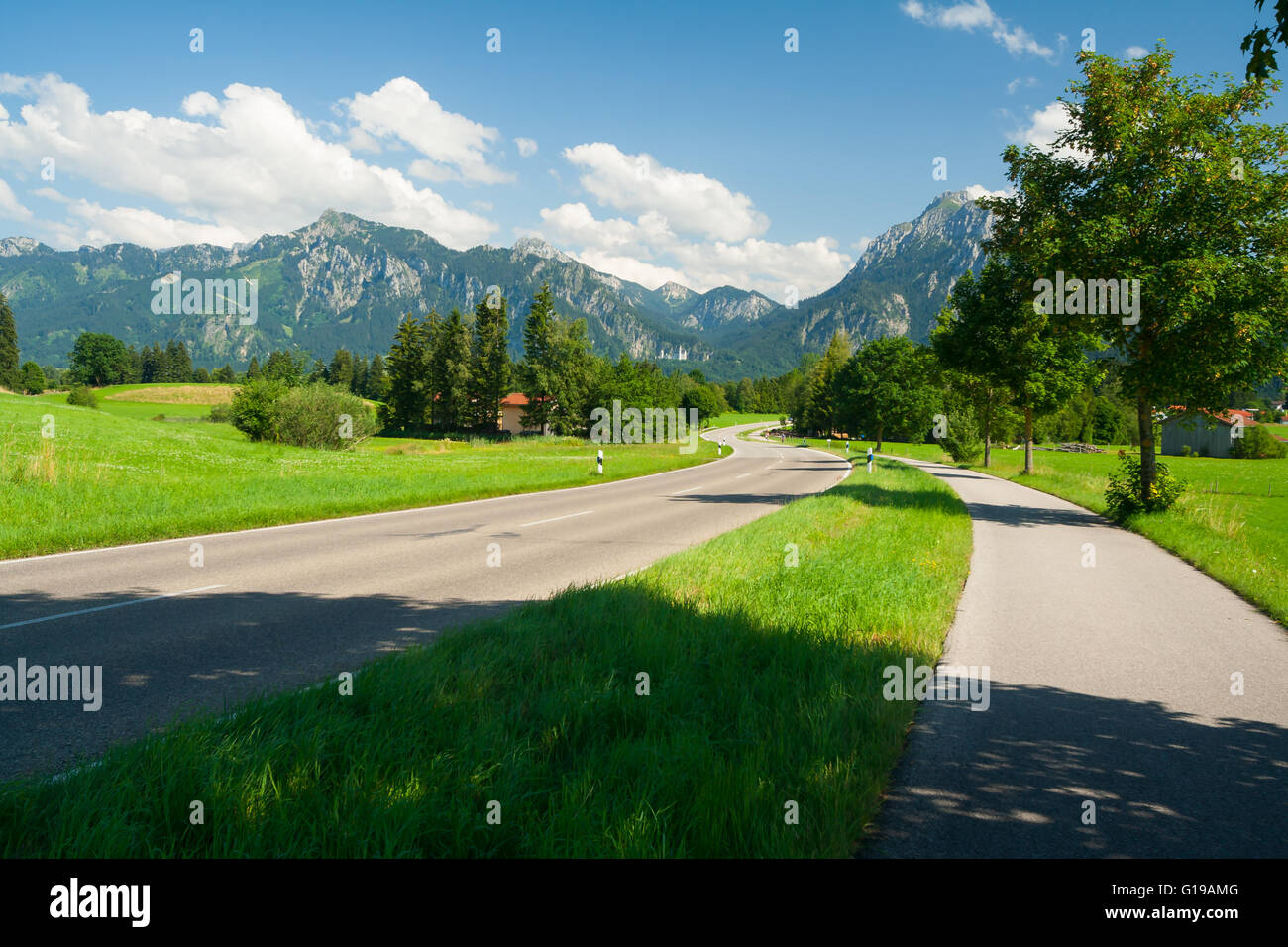 Street heading to the alps in Bavaria - Germany Stock Photo - Alamy