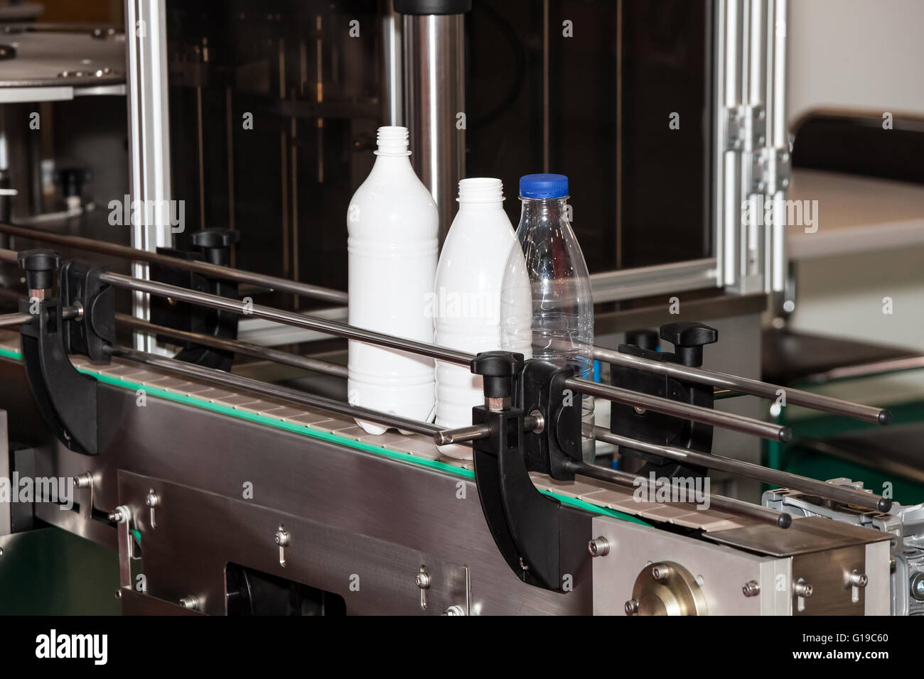 Packaging milk bottles line Stock Photo - Alamy