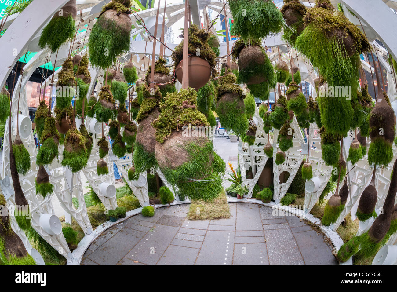 Hanging plants adorn the Times Square Electronic Garden in New York on ...