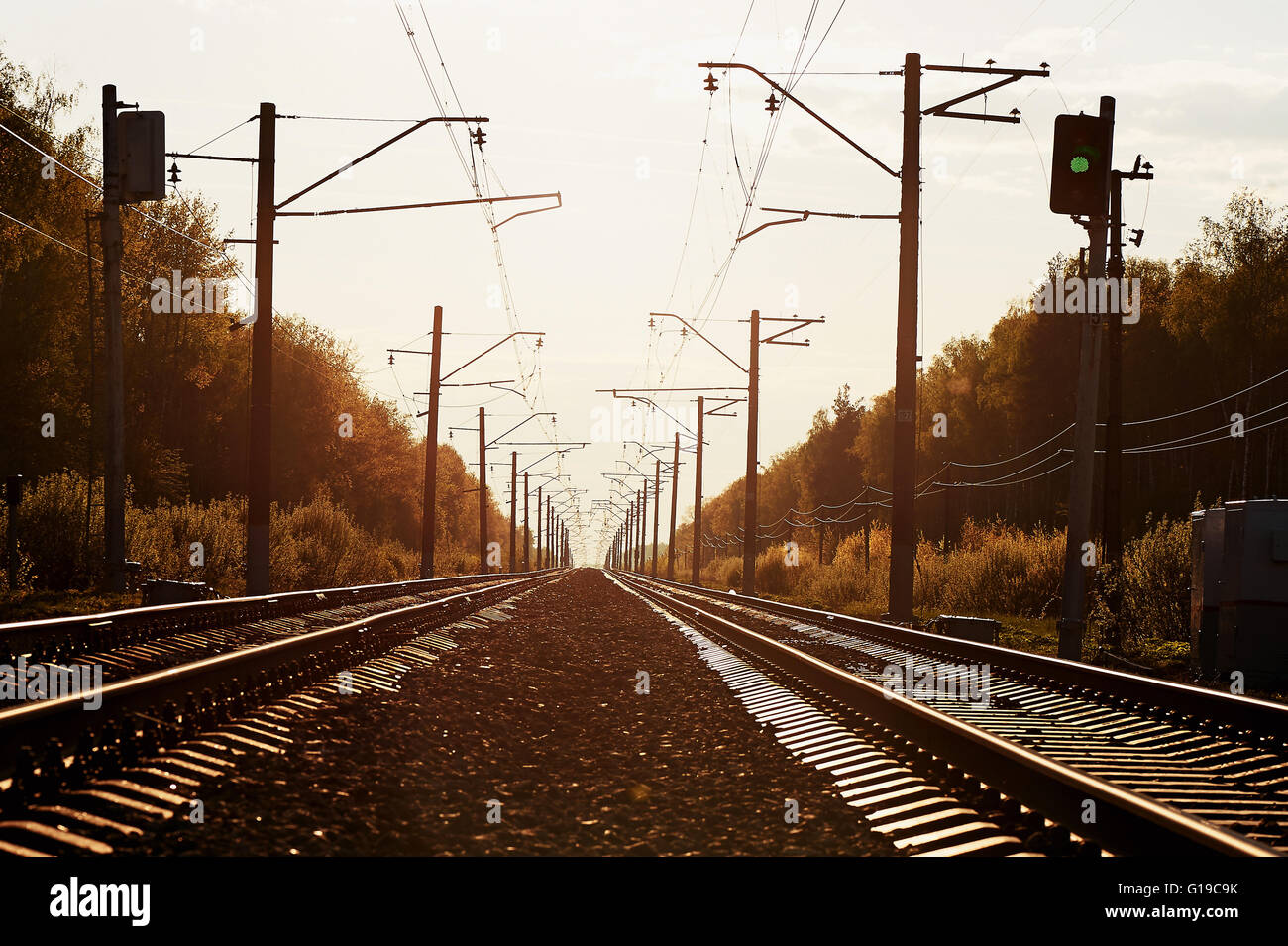 junction of railways track in trains station against beautiful light ...