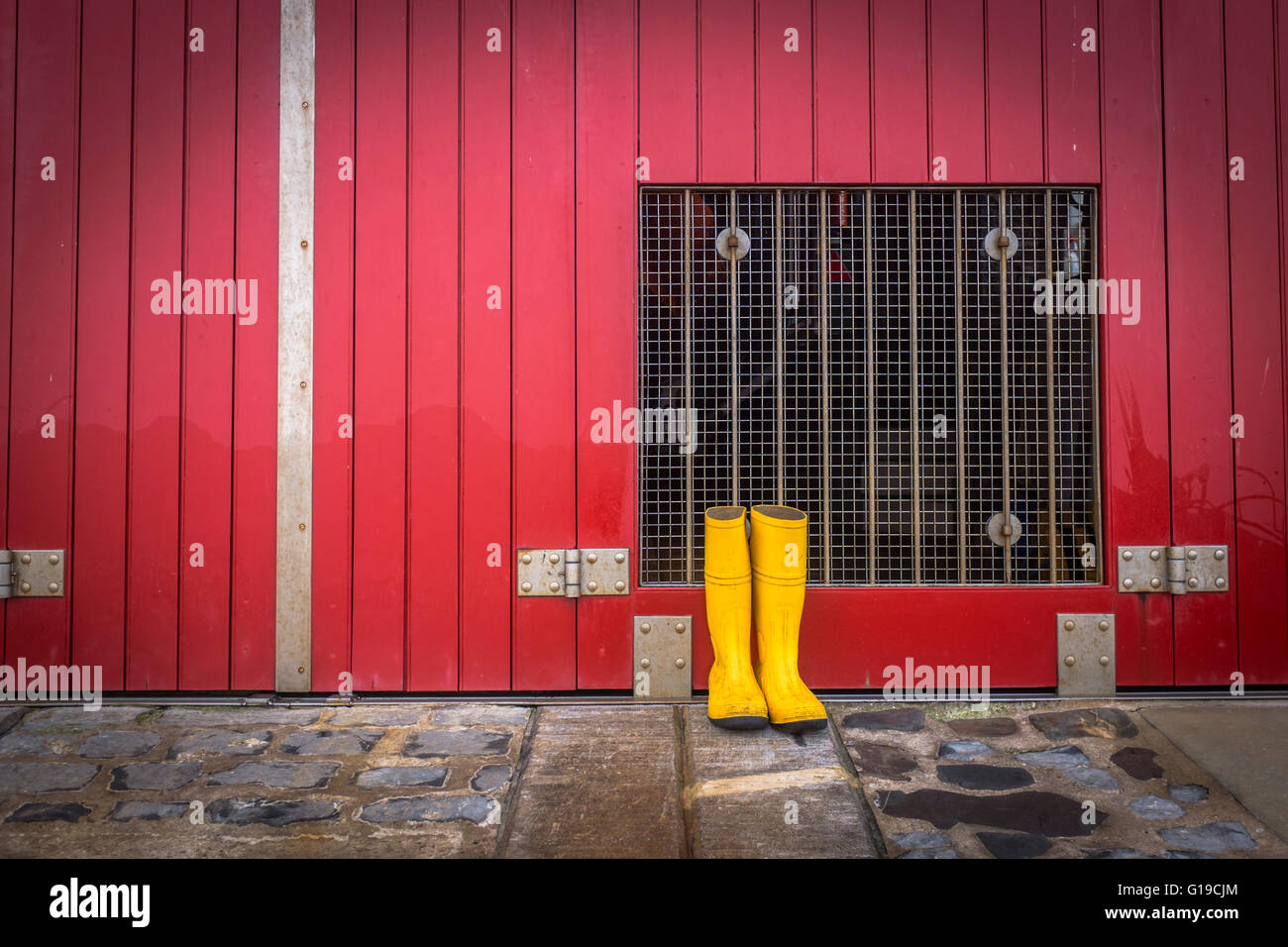Yellow wellington boots outside the RNLI lifeboat station at Clovelly ...