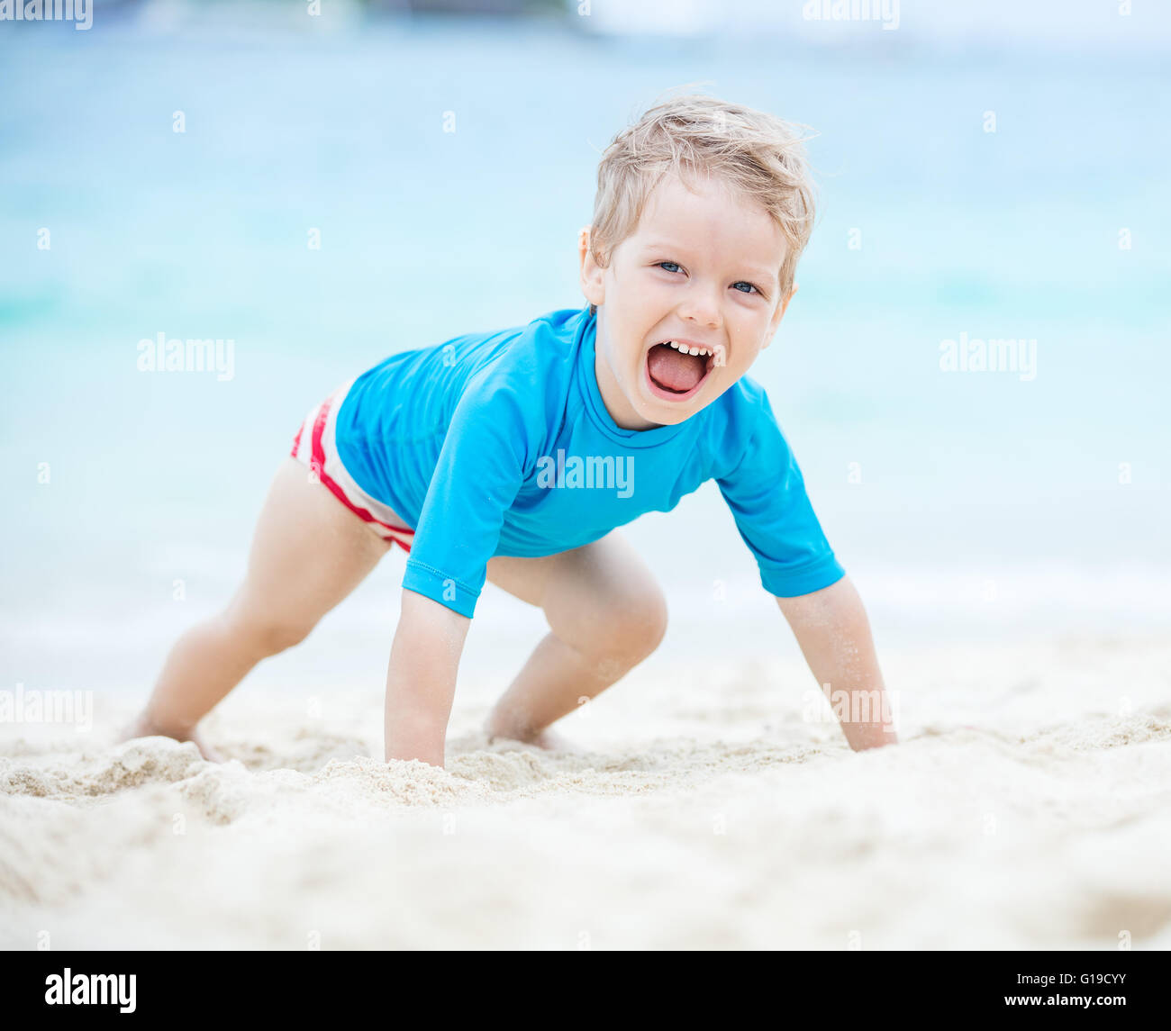 Boy playing on the beach hi-res stock photography and images - Alamy